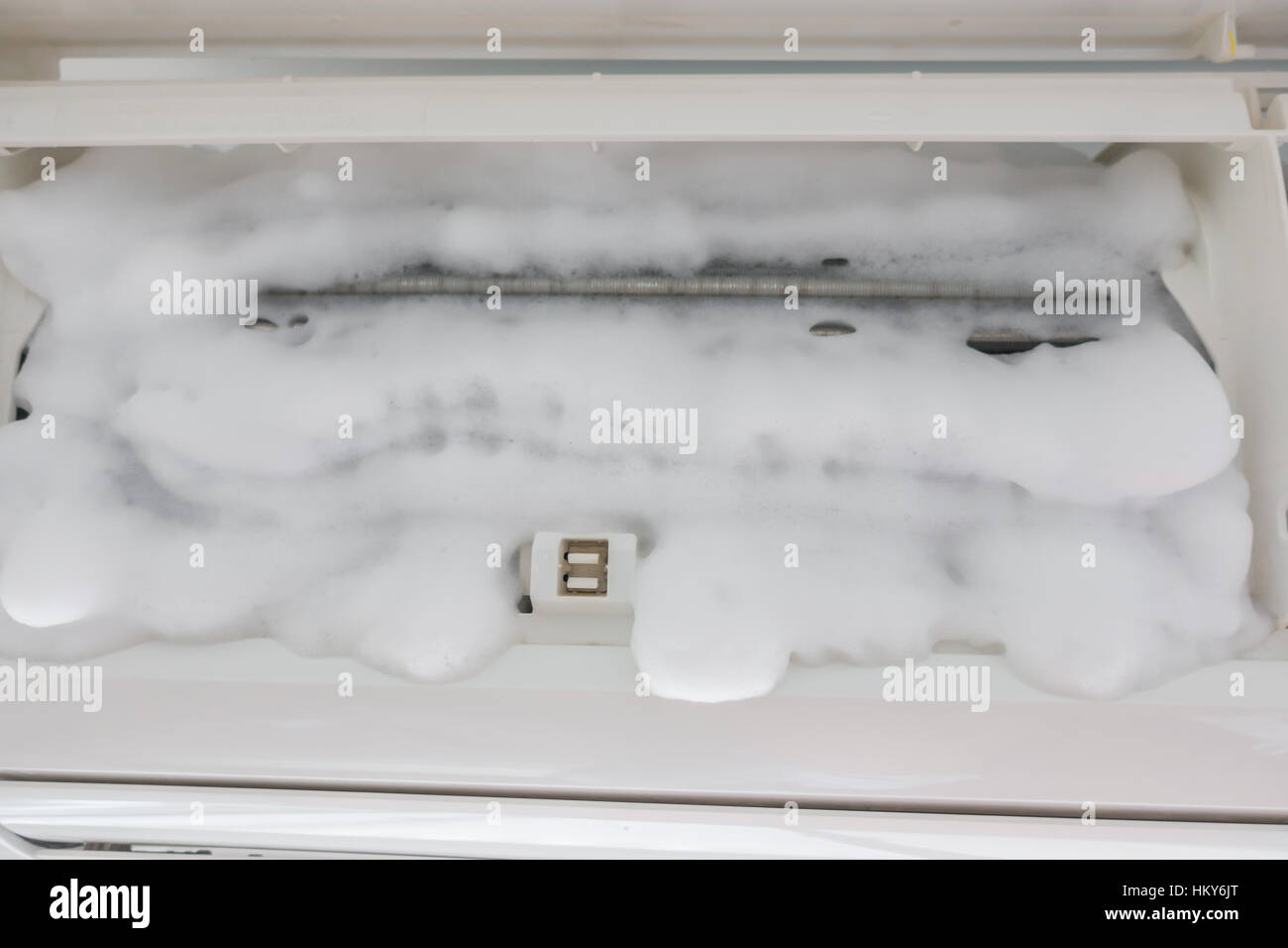 Air conditioner cleaning with washing foam Stock Photo - Alamy