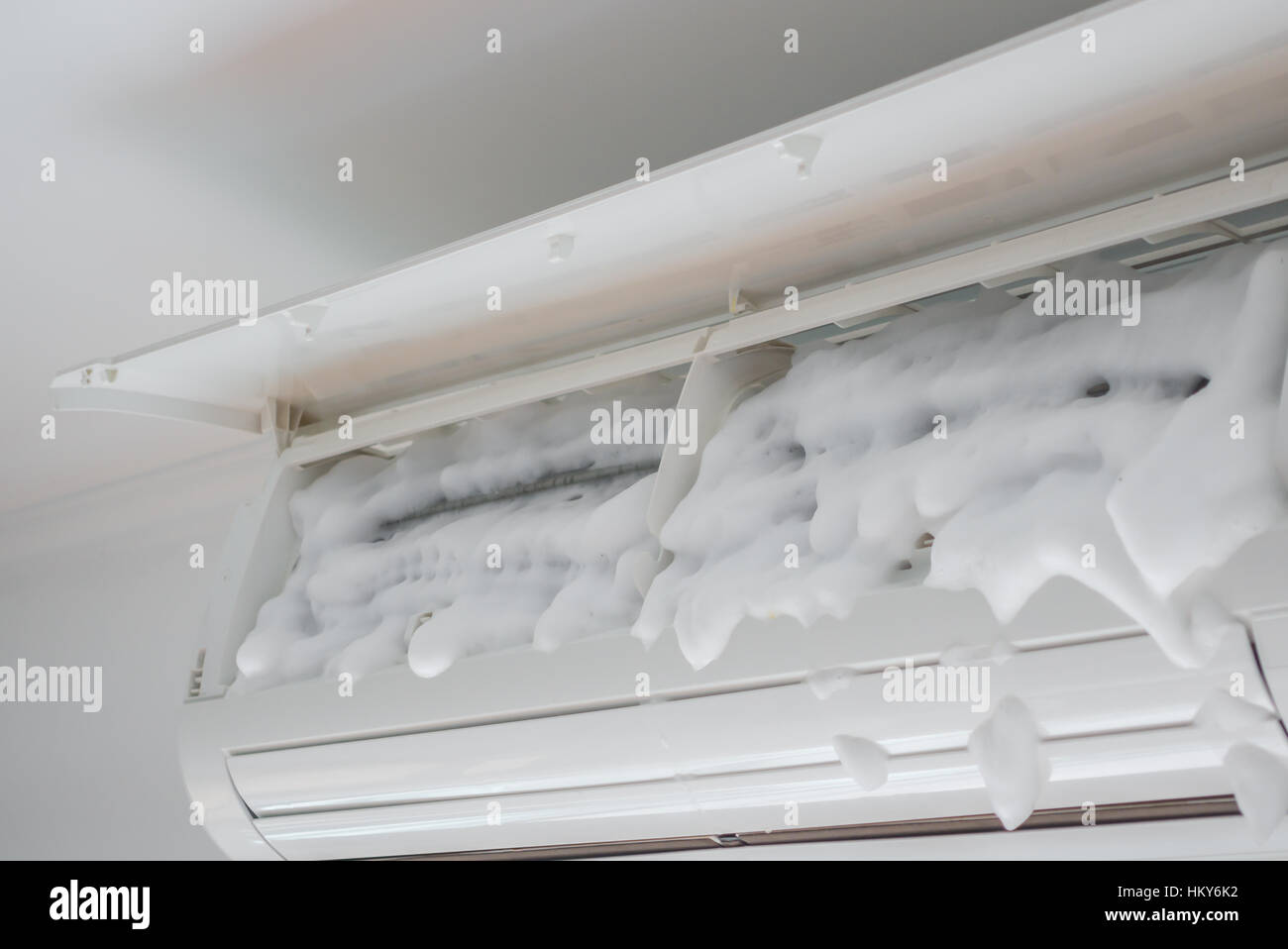 Air conditioner cleaning with washing foam Stock Photo - Alamy