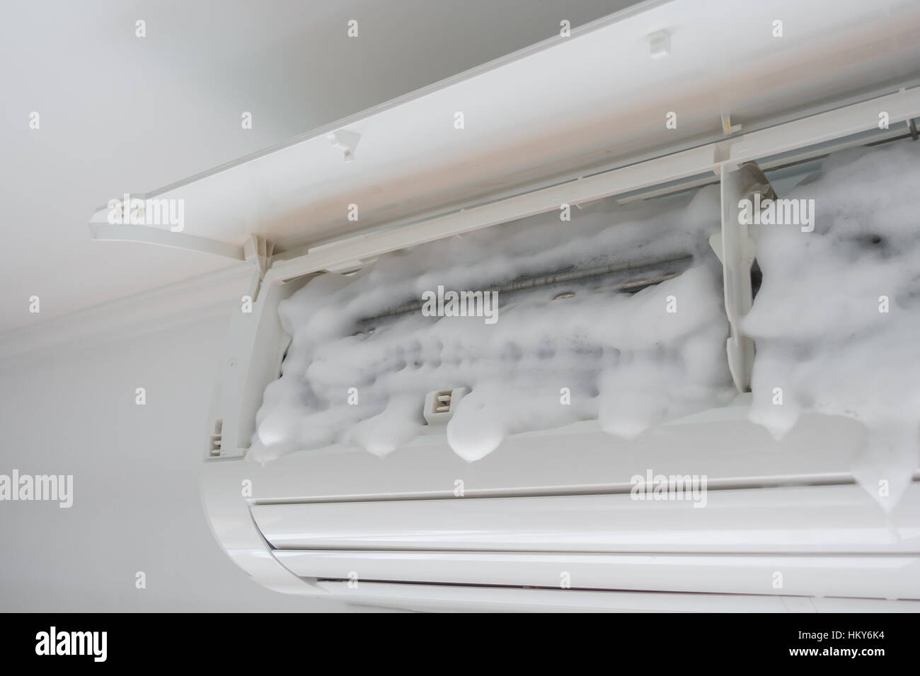 Air conditioner cleaning with washing foam Stock Photo - Alamy