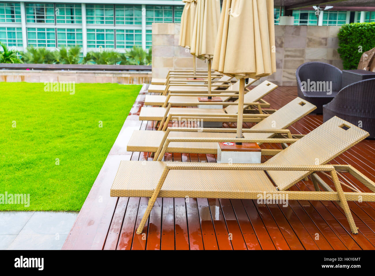 Swimming pool with relaxing seats Stock Photo - Alamy
