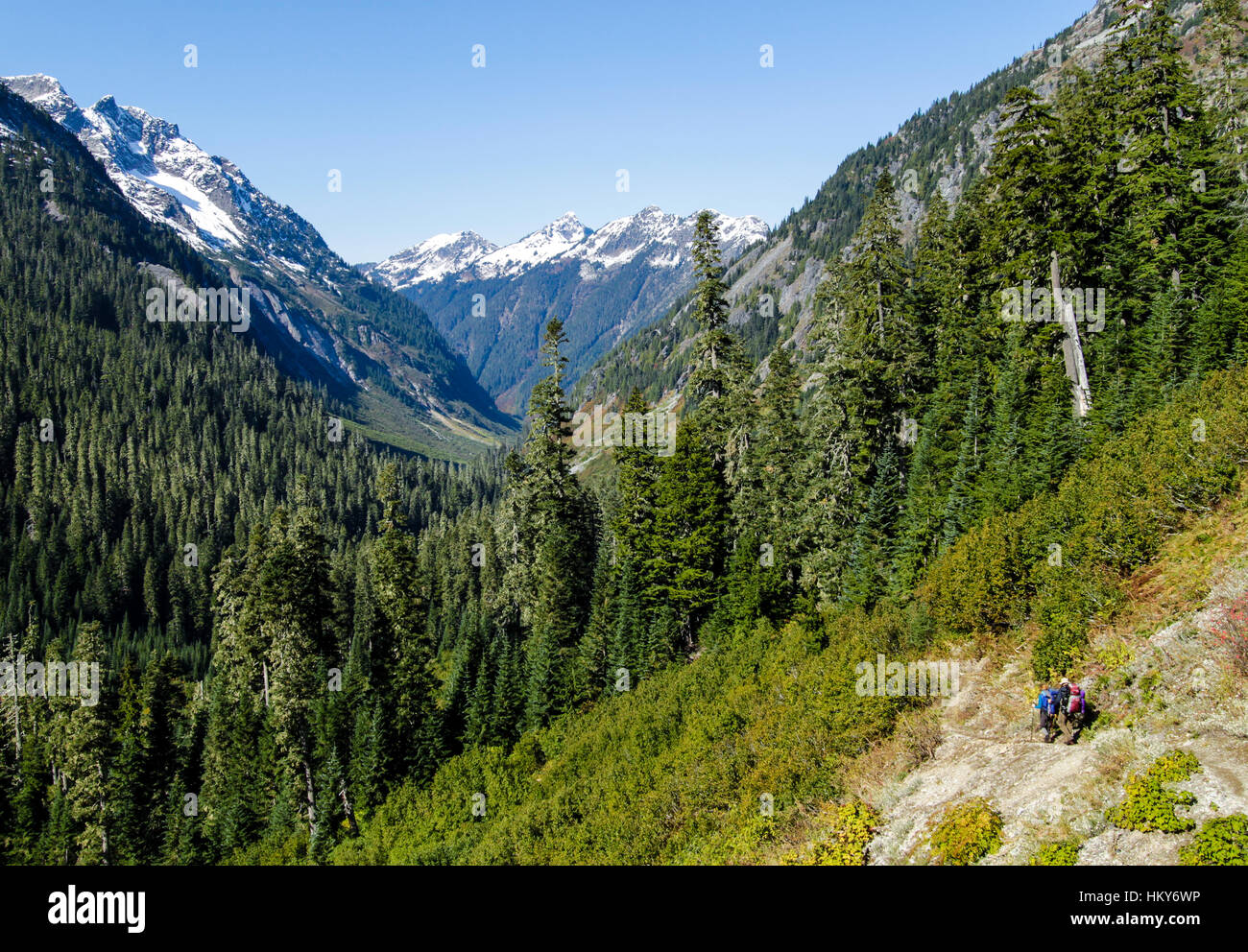 Hikers decend Hannegan Pass in the Mt. Baker-Snoqualmie National Forest ...