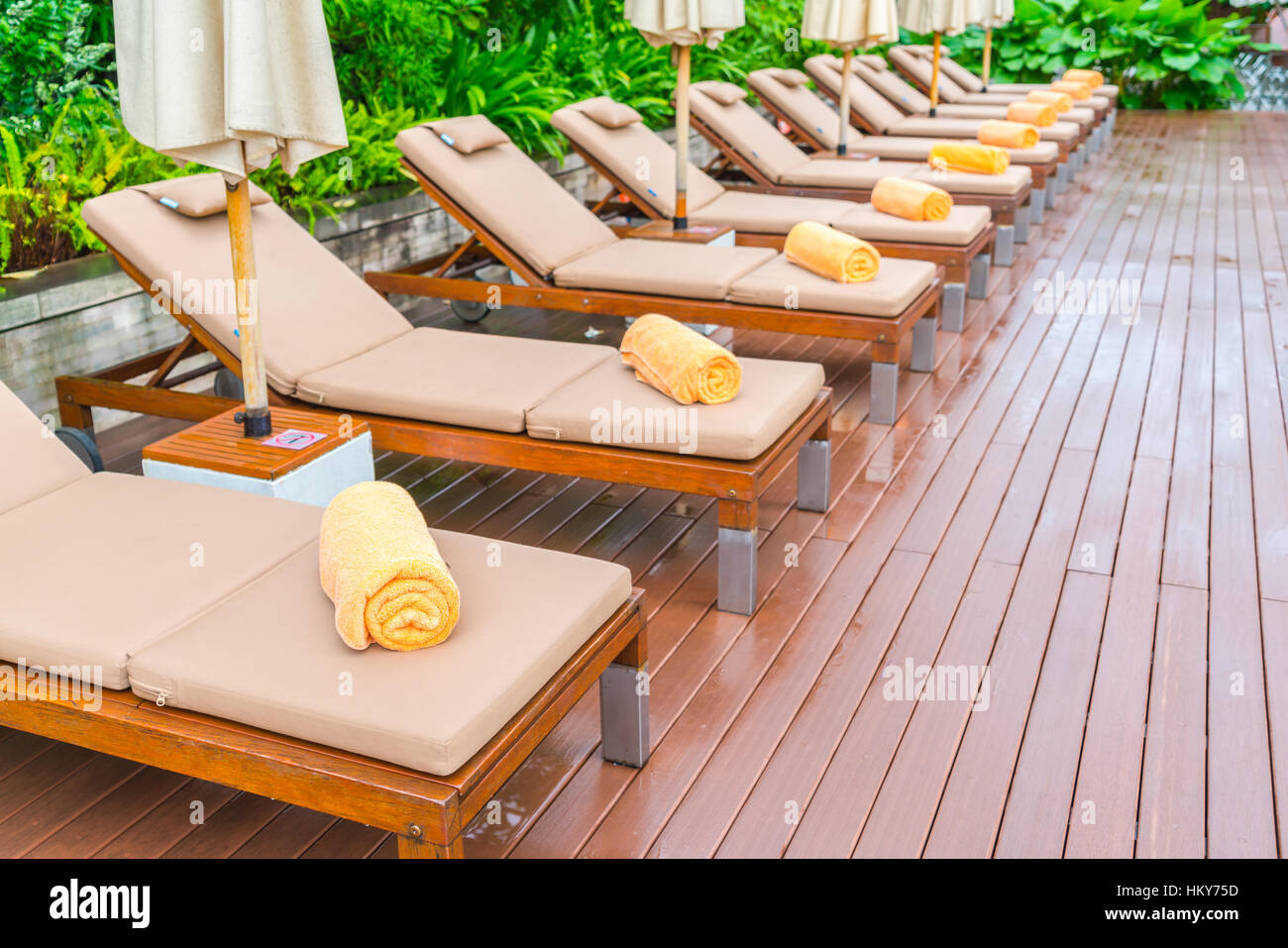 Swimming pool with relaxing seats Stock Photo - Alamy