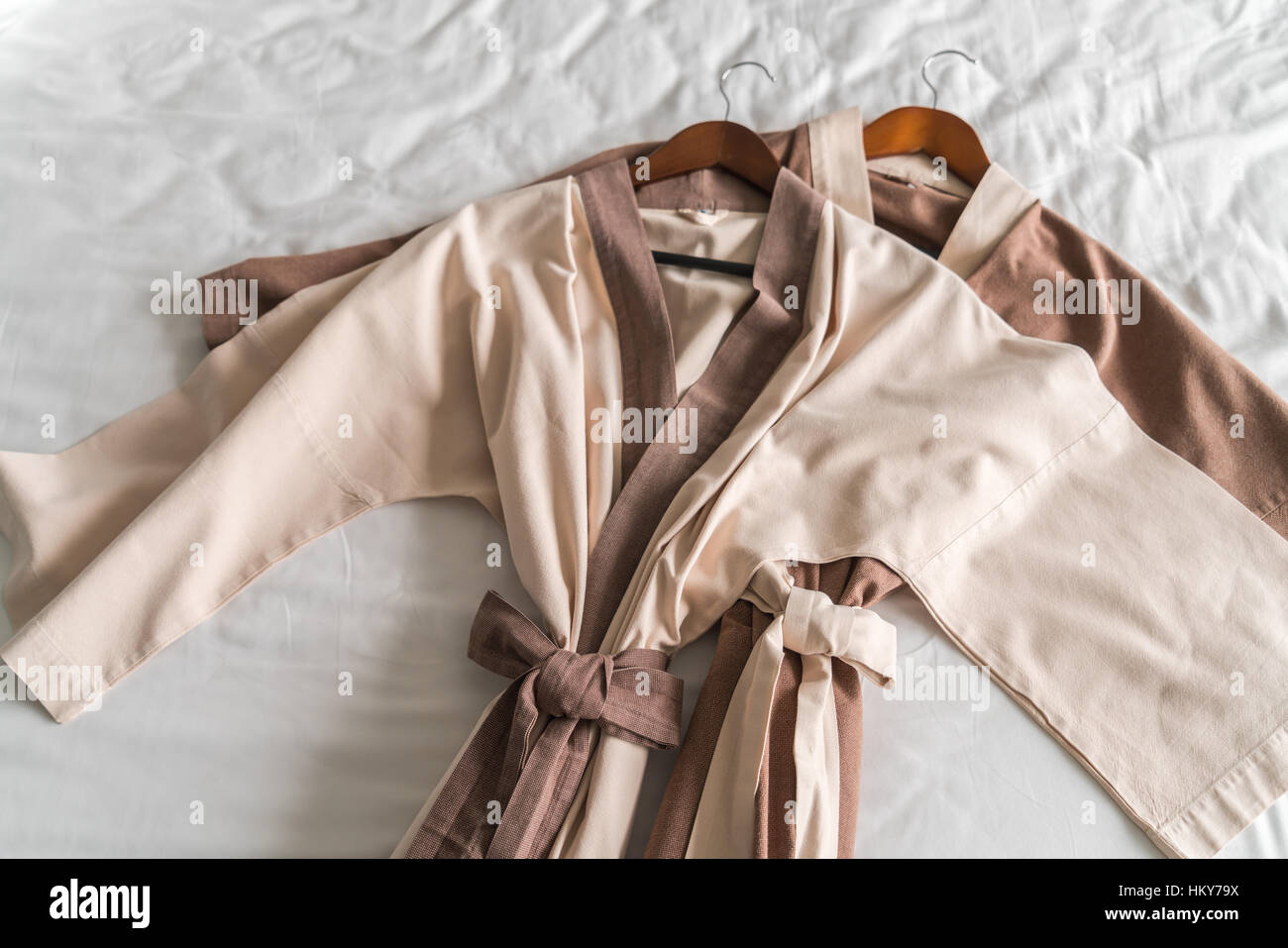 Clean bathrobe on bed Stock Photo - Alamy