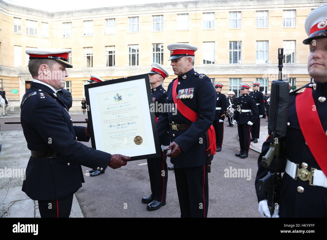 Lieutenant Colonel E Moorhouse RM hands the certificate of the freedom ...
