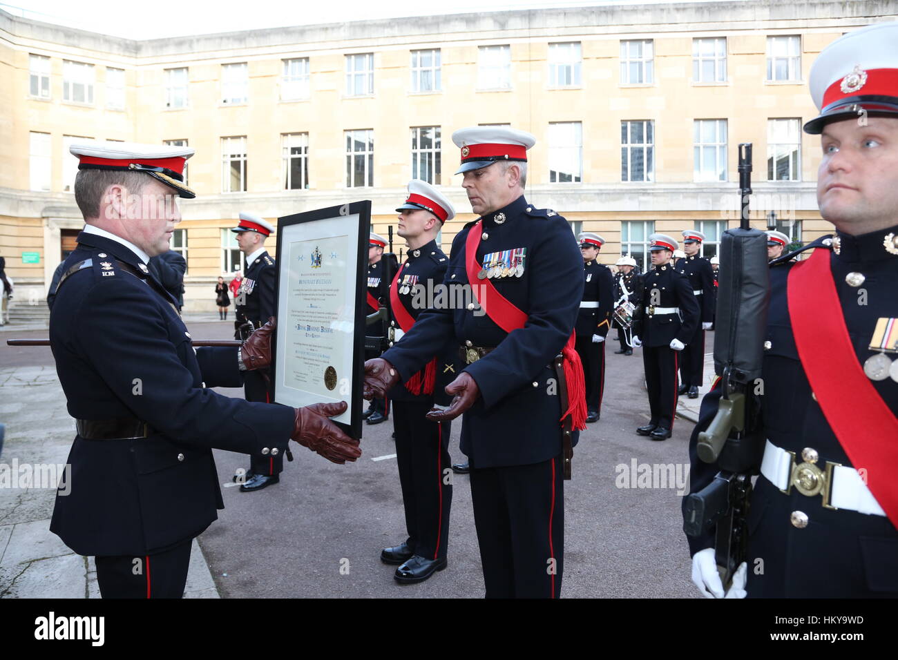 Lieutenant Colonel E Moorhouse RM hands the certificate of the freedom ...