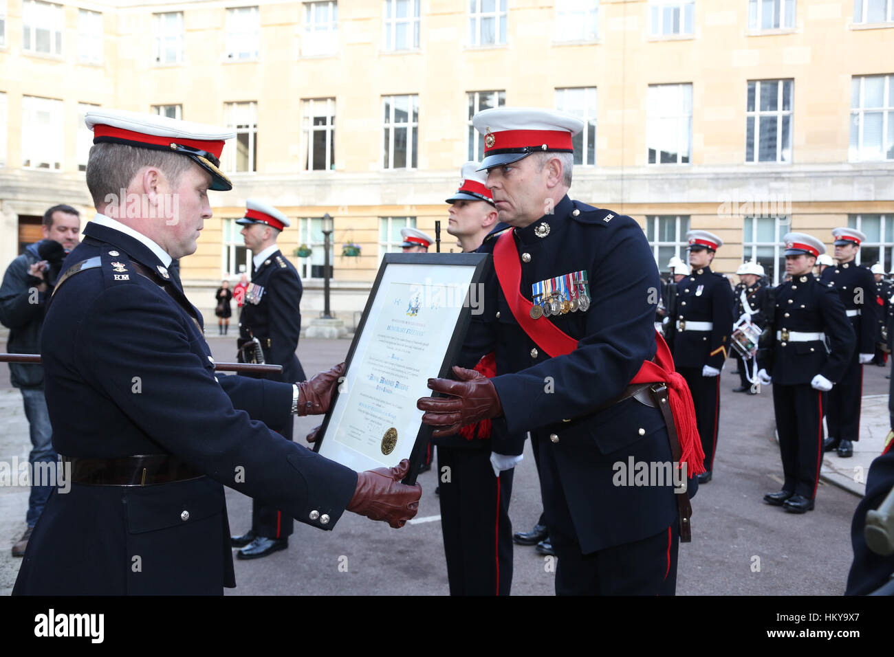 Lieutenant Colonel E Moorhouse RM hands the certificate of the freedom ...