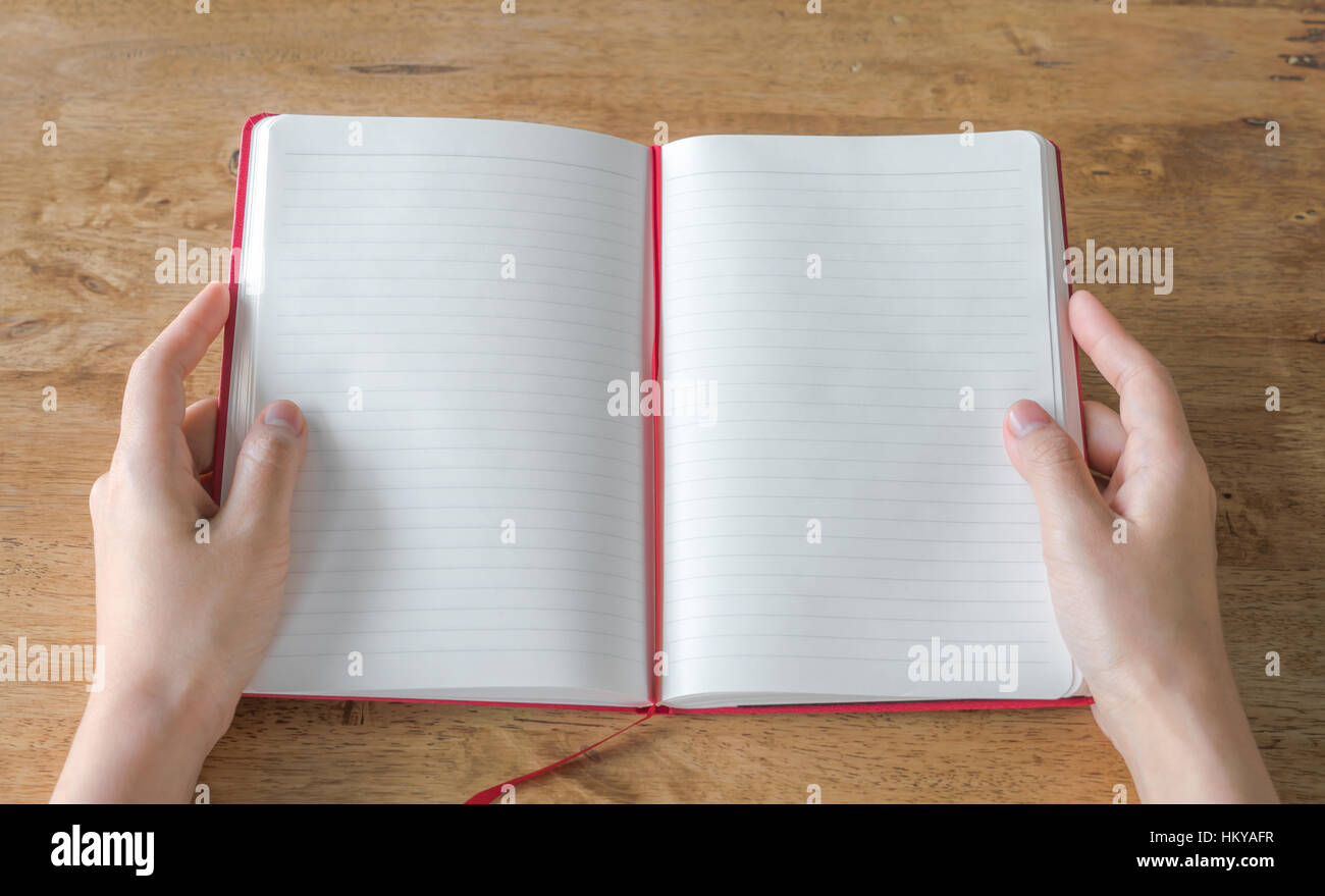 Hands open Blank catalog, magazines,book mock up on wood table Stock ...