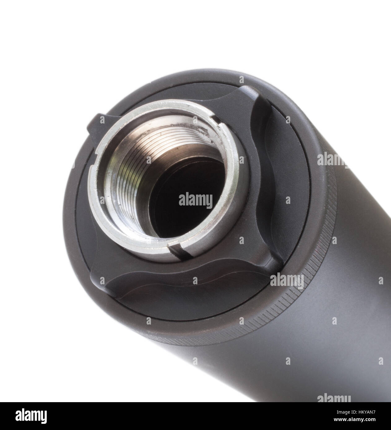 End of a suppressor that screws onto a firearm on a white background ...