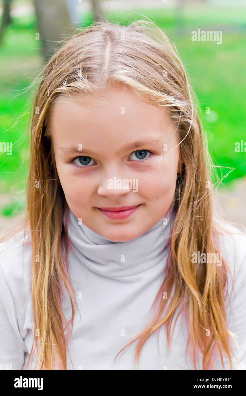 Cute girl with blond long hair and blue eyes Stock Photo - Alamy