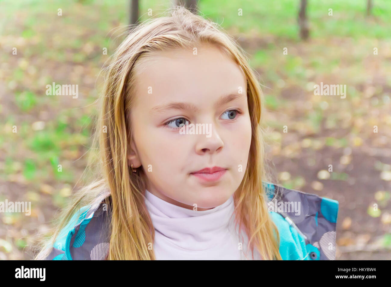 Photo of chewing cute girl with blond hair Stock Photo - Alamy