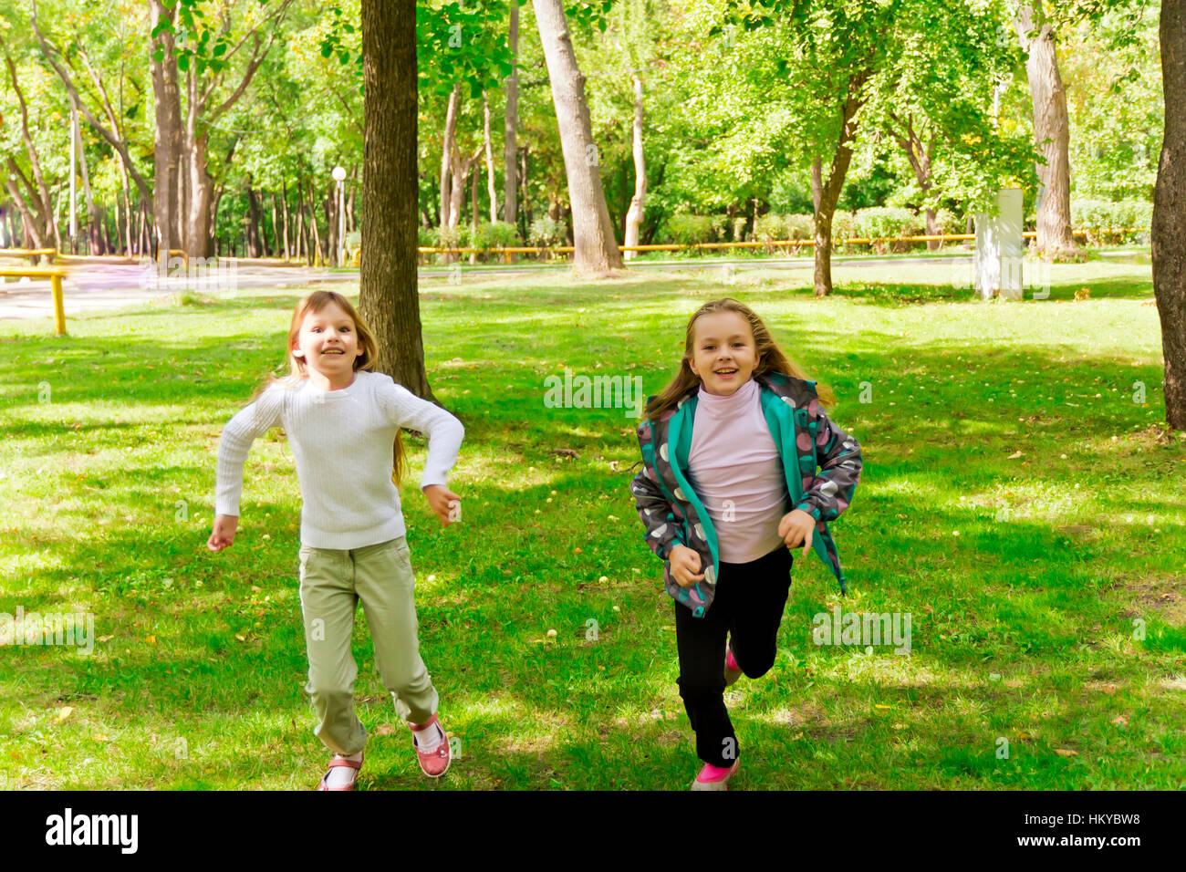 Photo of two running girls in summer Stock Photo - Alamy