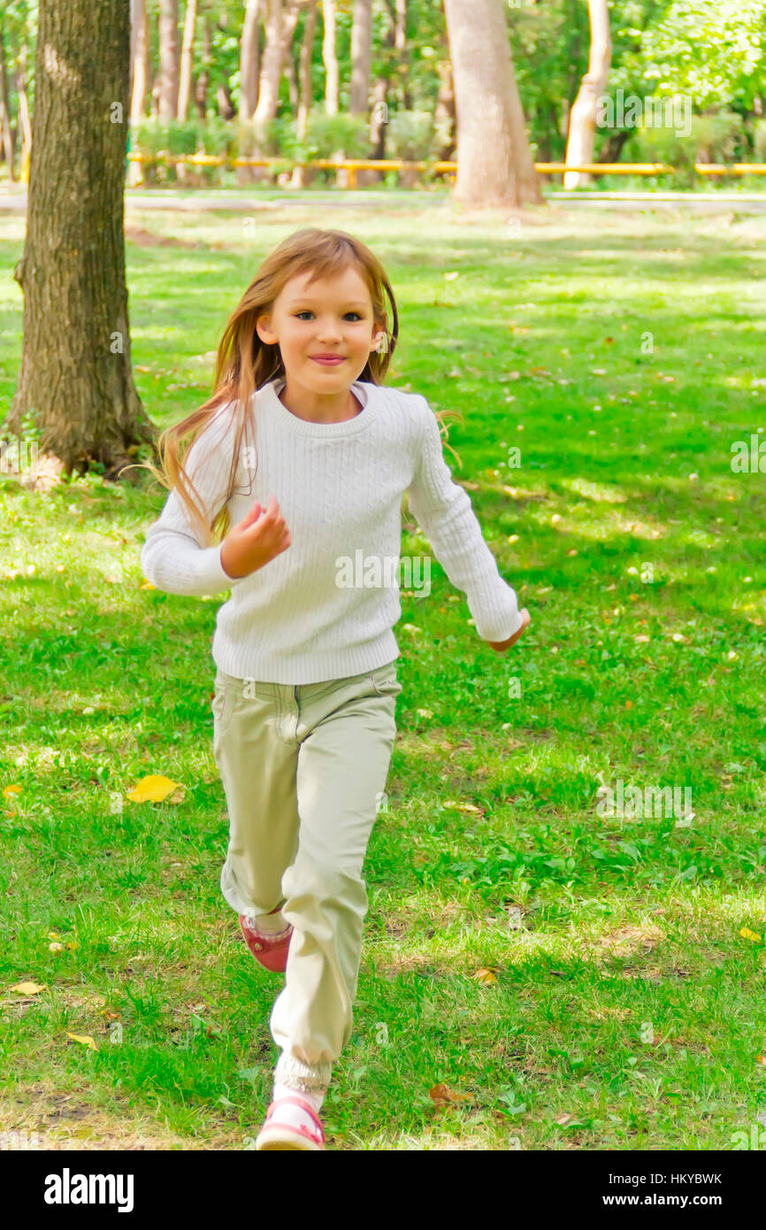 Photo of cute running girl in summer Stock Photo - Alamy
