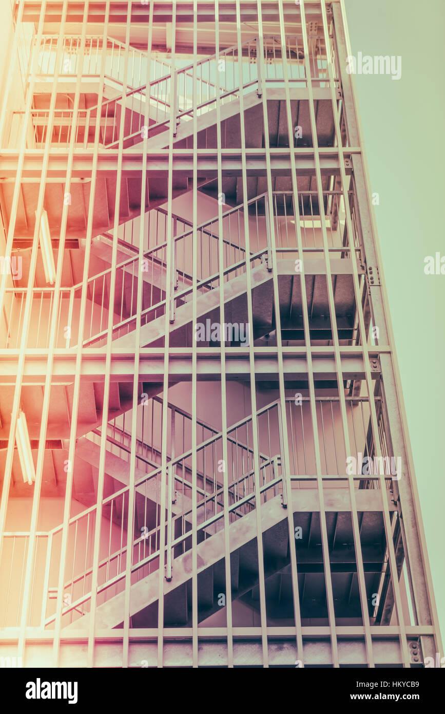 Metal fire escape outside building ( Filtered image processed vintage ...