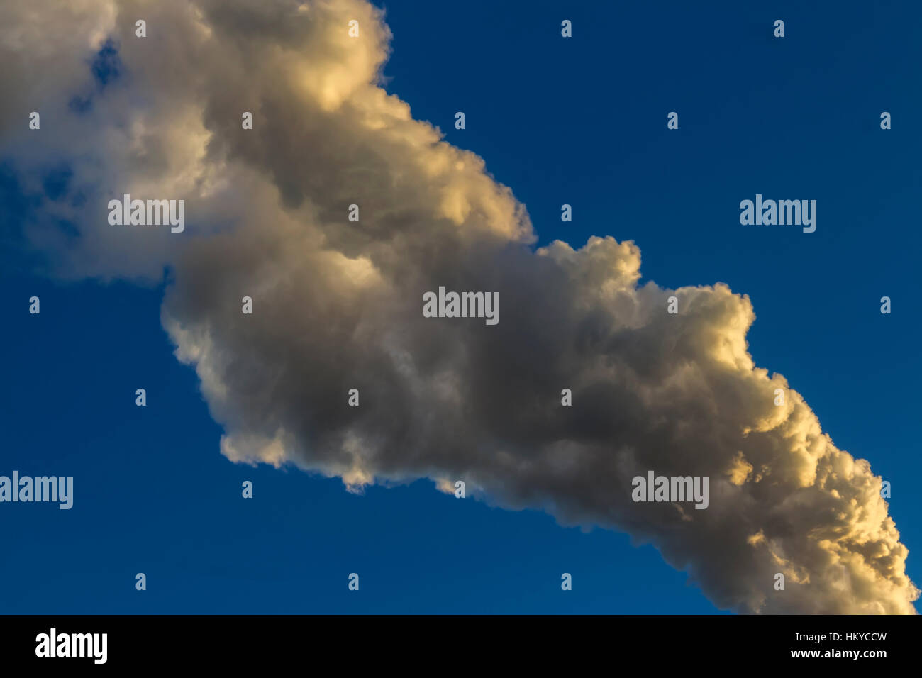 clouds of smoke and vapor in blue sky Stock Photo - Alamy