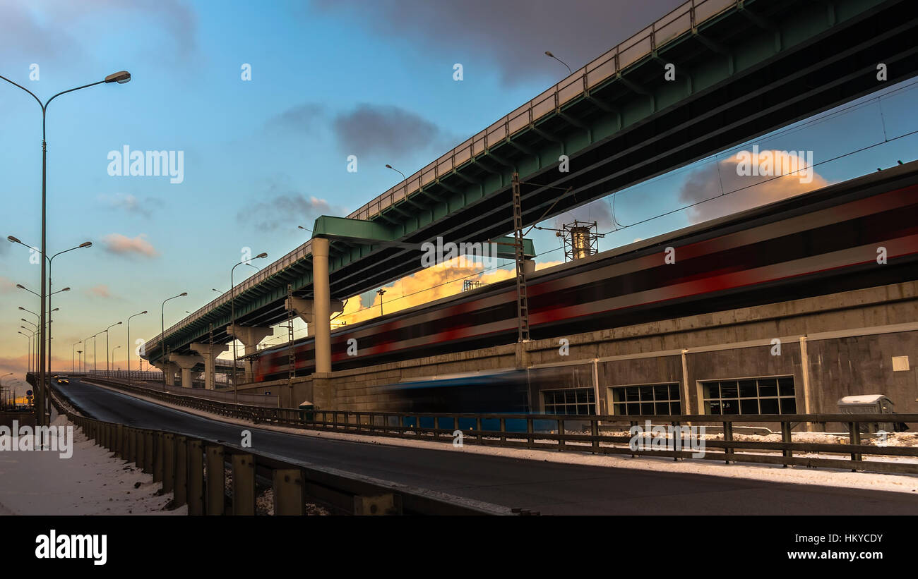 railroad train fast motion by modern overpass Stock Photo - Alamy