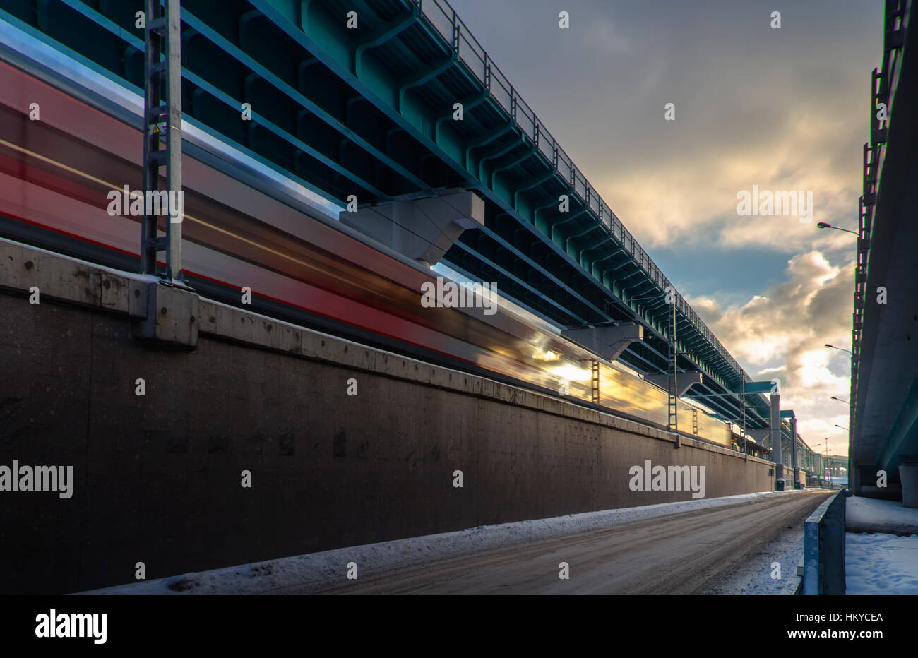 railroad train fast motion by modern overpass Stock Photo - Alamy