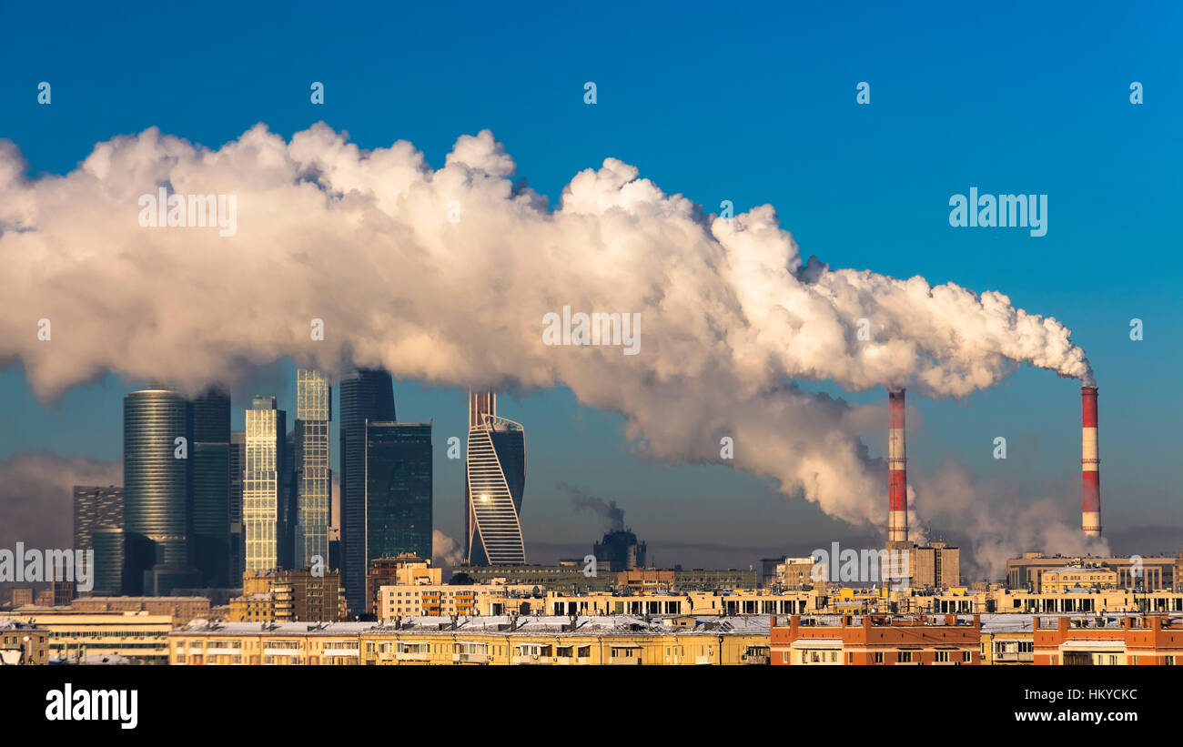 power plant emitting smoke and vapor in cold weather Stock Photo - Alamy