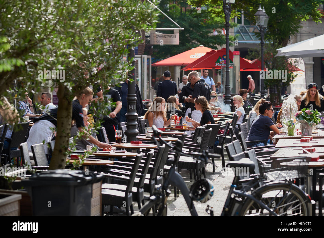NEUSS, GERMANY - AUGUST 08, 2016: Visitors enjoy a restaurant with food ...