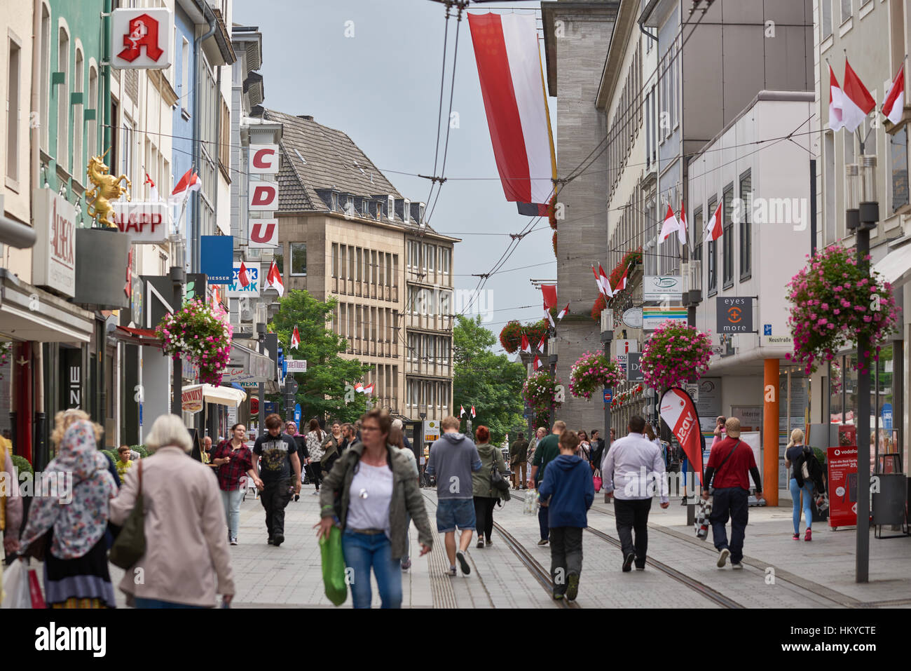 NEUSS, GERMANY - AUGUST 08, 2016: Pedestrants walking along a city ...
