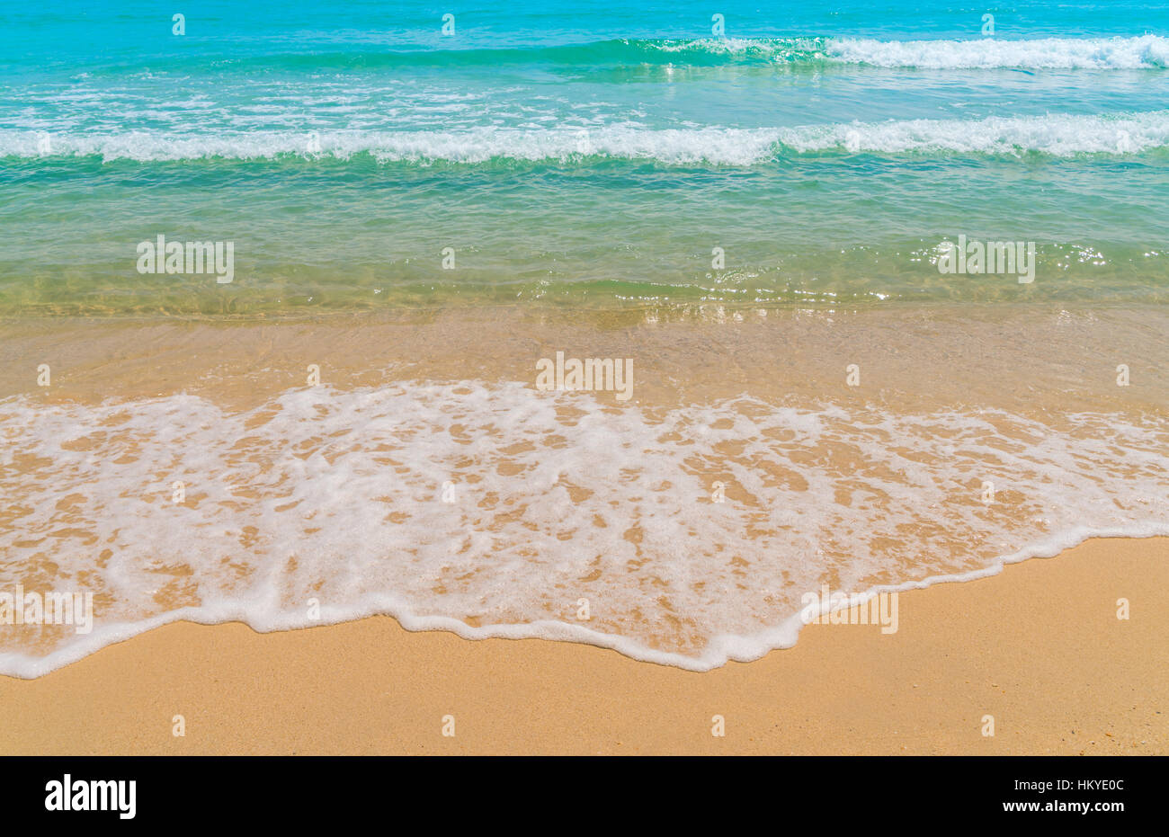 Wave of sea on the sand beach Stock Photo - Alamy
