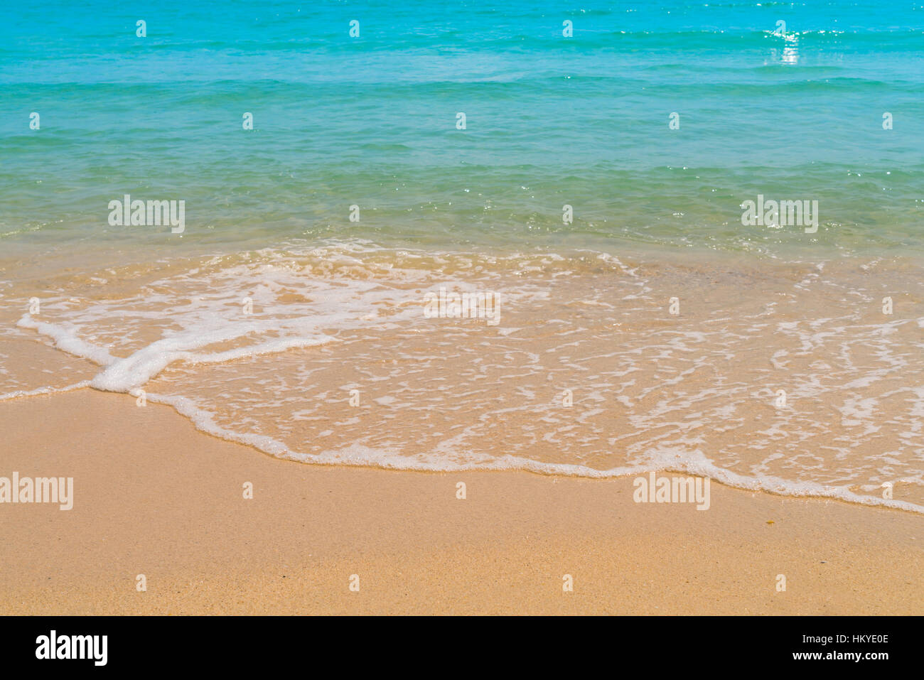 Wave of sea on the sand beach Stock Photo - Alamy