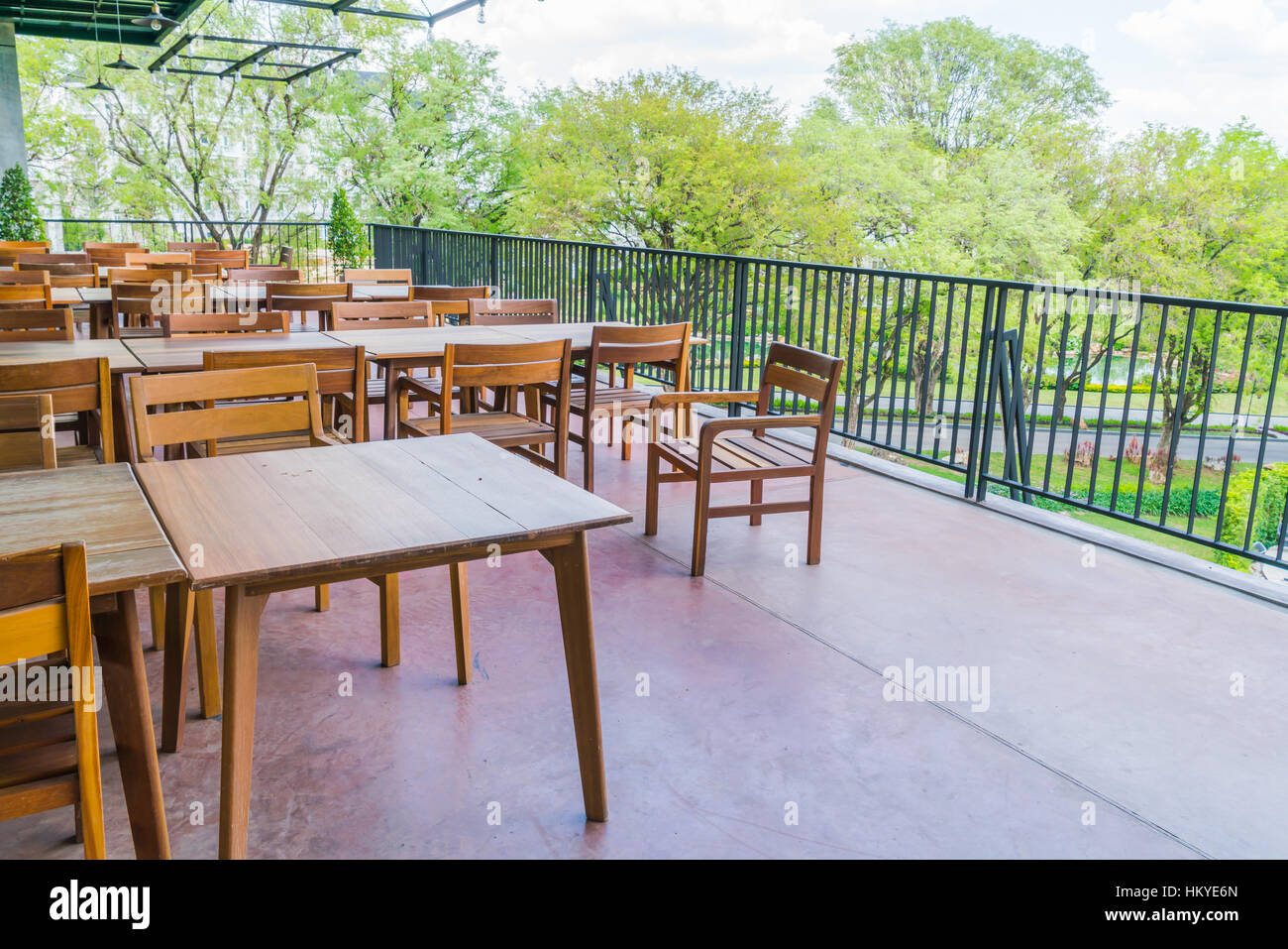 Tables and chairs in restaurant Stock Photo - Alamy
