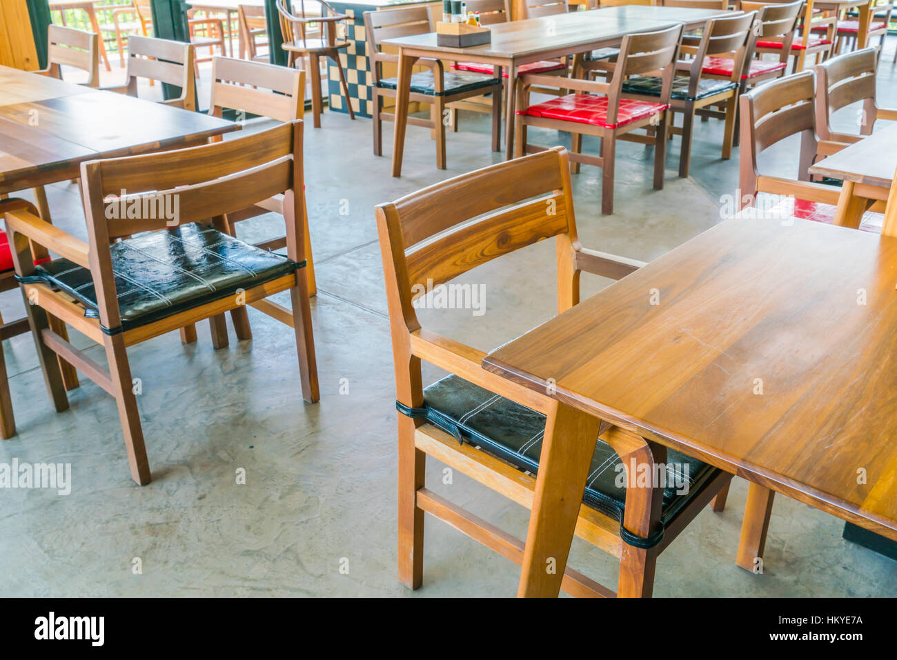 Tables and chairs in restaurant Stock Photo - Alamy