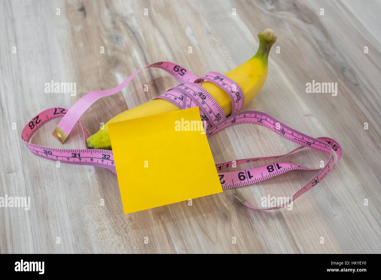 Banana with Sticky Note on wood table Stock Photo - Alamy