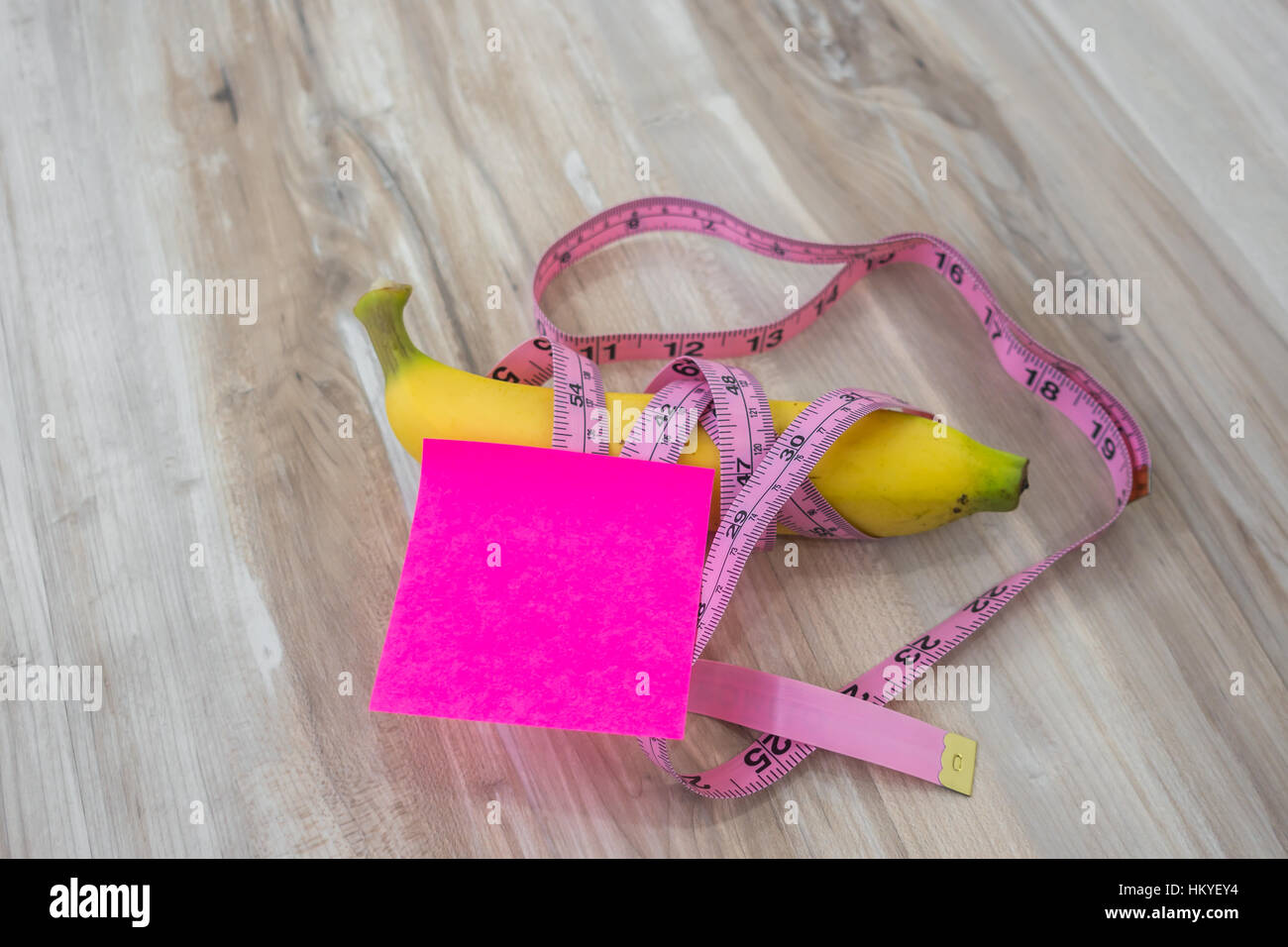 Banana with Sticky Note on wood table Stock Photo - Alamy