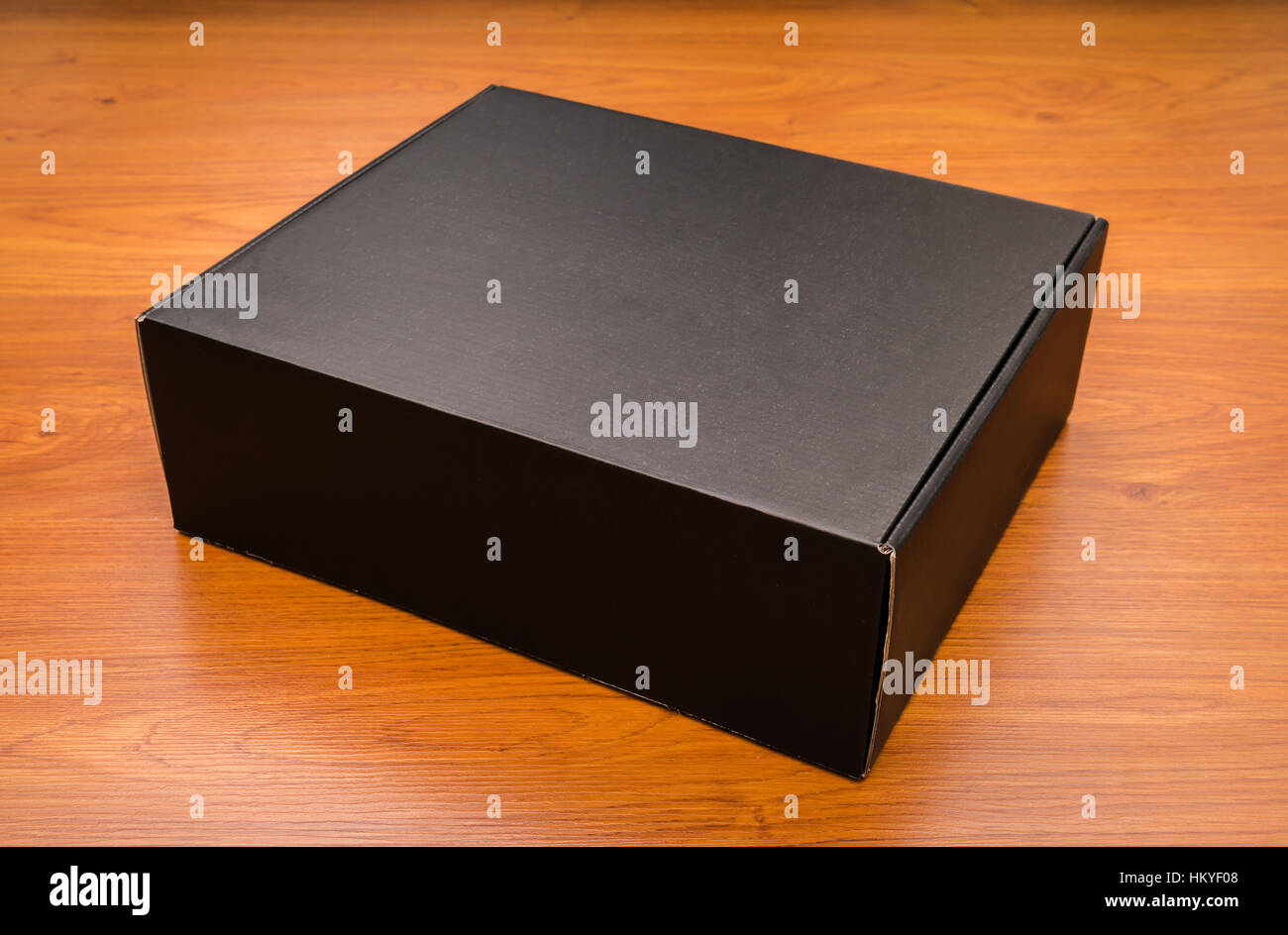 Blank black box mock up on wood background Stock Photo - Alamy