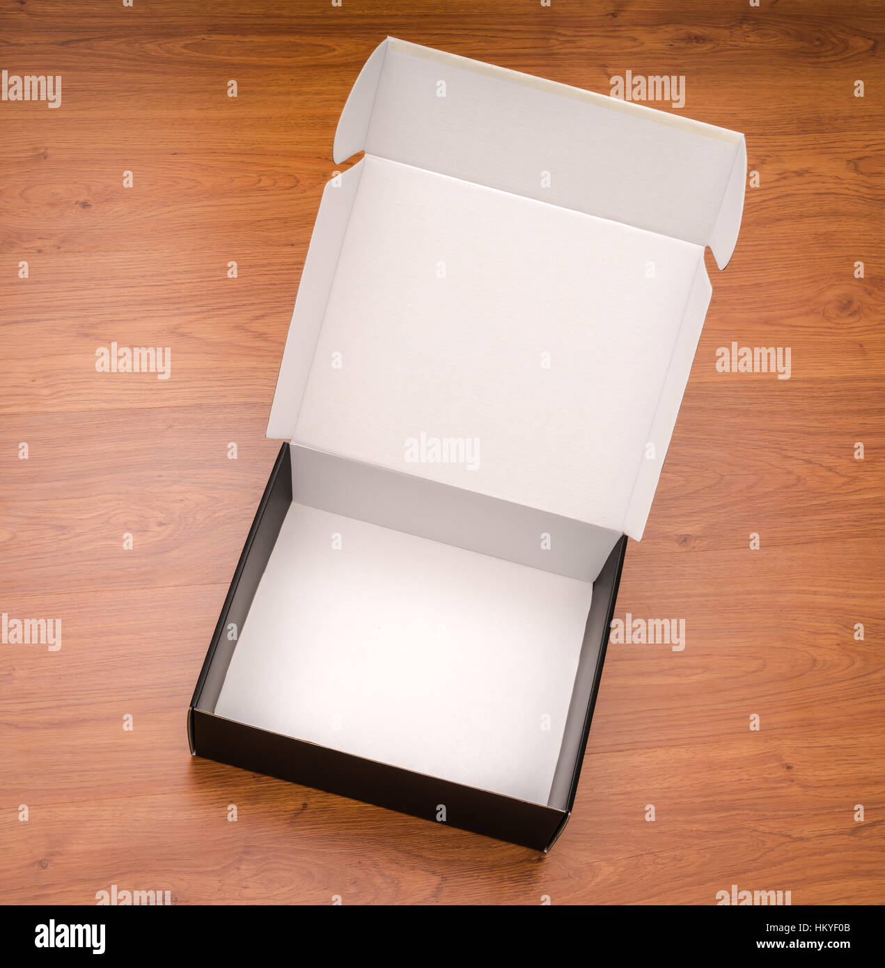 Blank black box mock up on wood background Stock Photo - Alamy