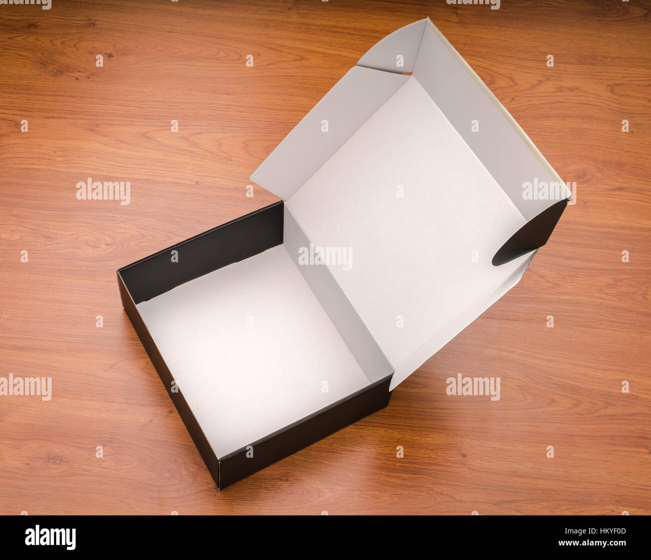 Blank black box mock up on wood background Stock Photo - Alamy
