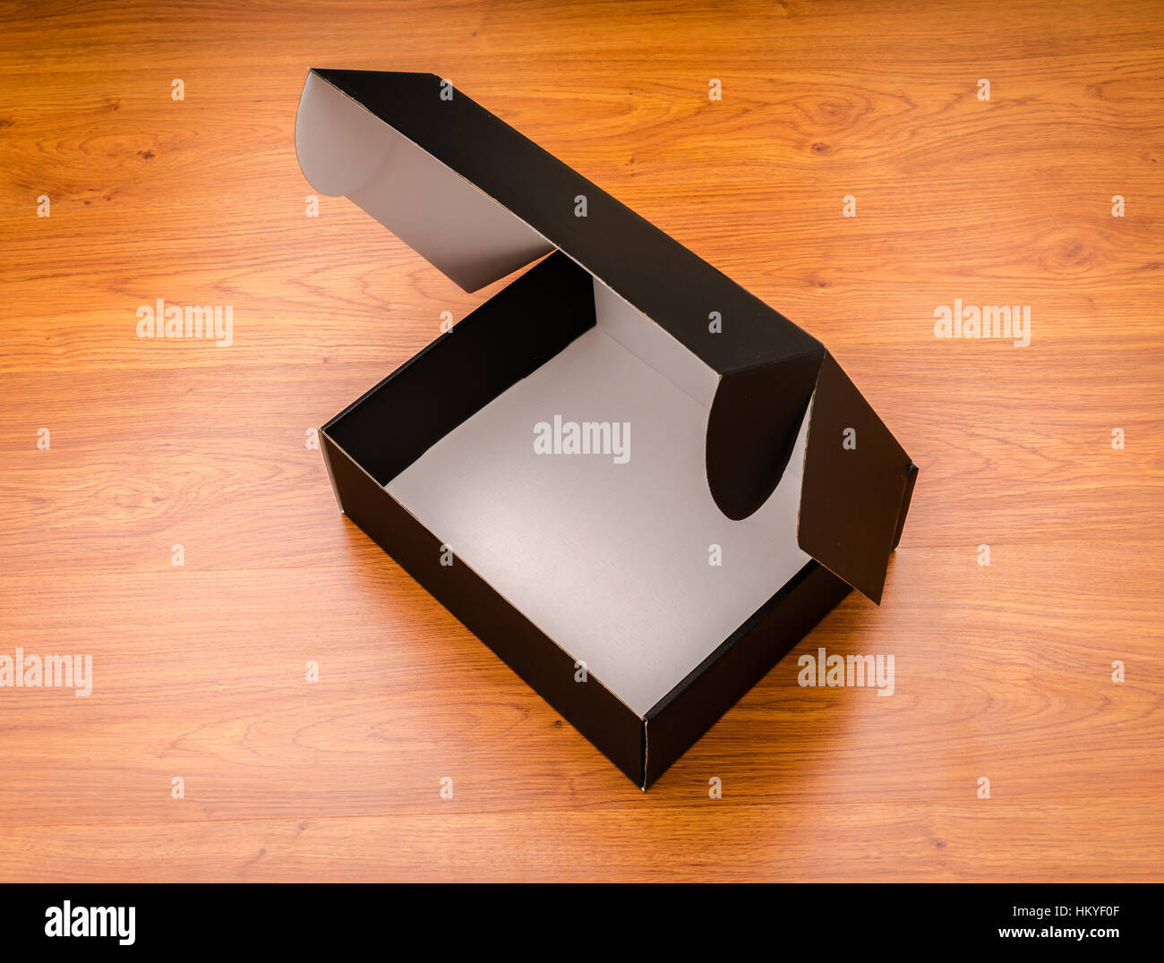 Blank black box mock up on wood background Stock Photo - Alamy