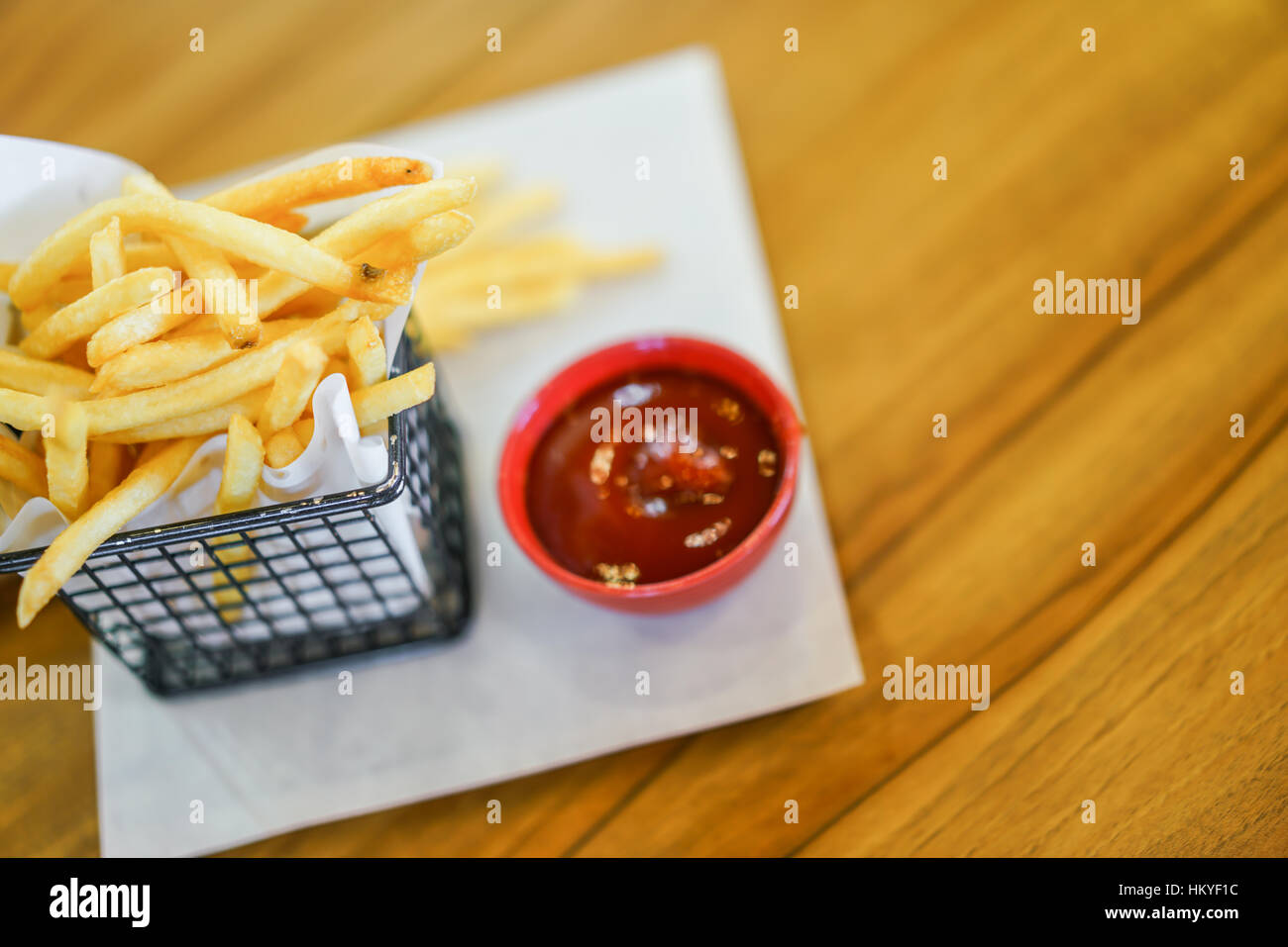 French fries on wood table Stock Photo - Alamy