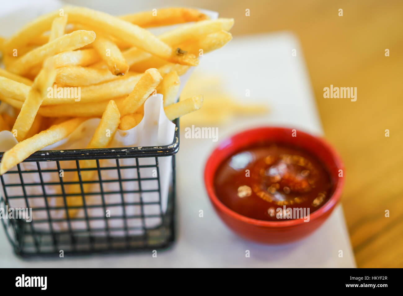 French fries on wood table Stock Photo - Alamy