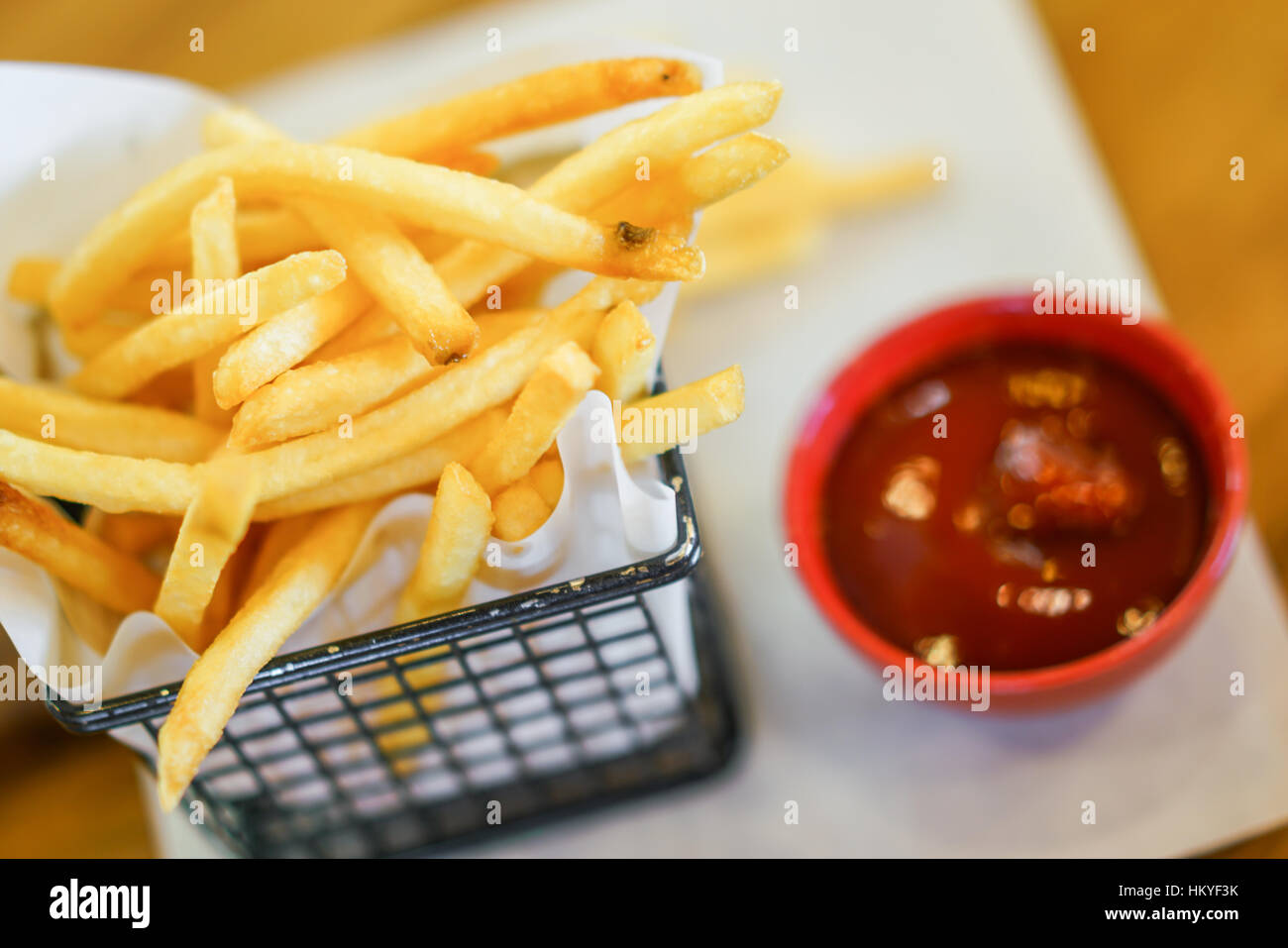 French fries on wood table Stock Photo - Alamy