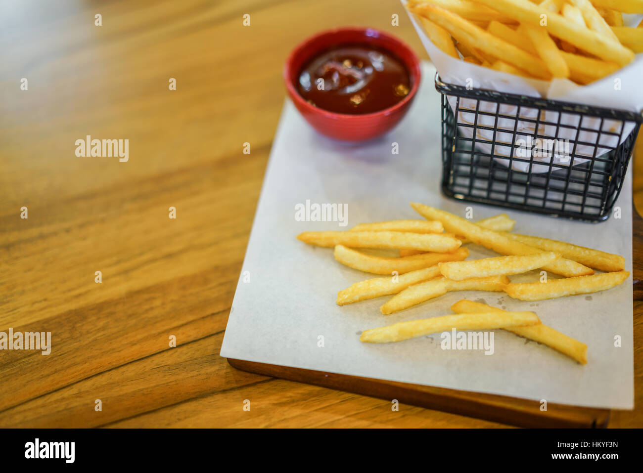 French fries on wood table Stock Photo - Alamy