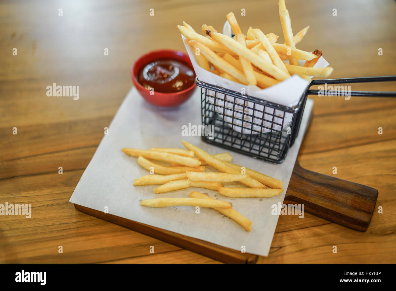 French fries on wood table Stock Photo - Alamy