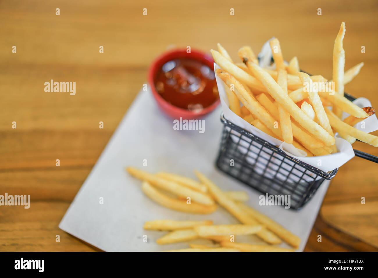 French fries on wood table Stock Photo - Alamy