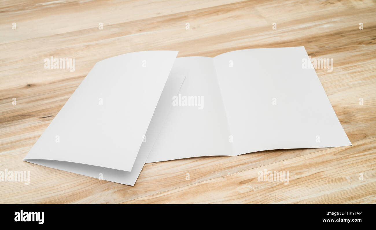 Bifold white template paper on wood texture Stock Photo - Alamy