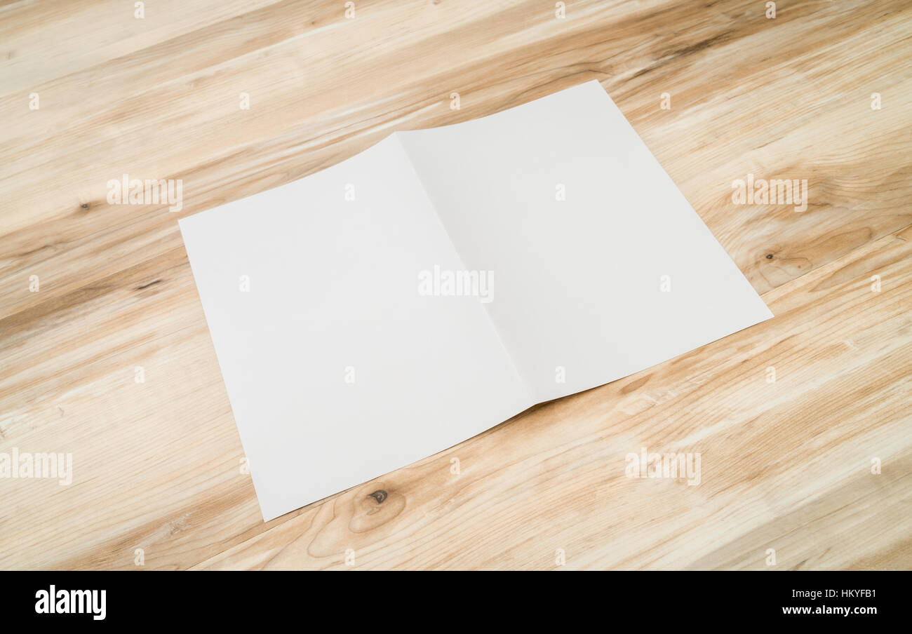 Bifold white template paper on wood texture Stock Photo - Alamy
