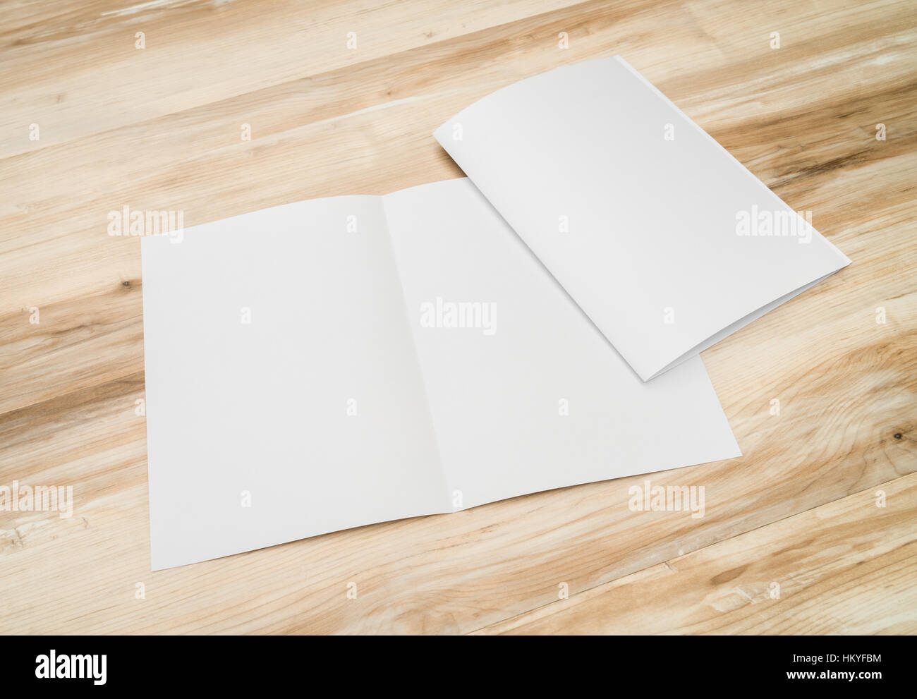 Bifold white template paper on wood texture Stock Photo - Alamy