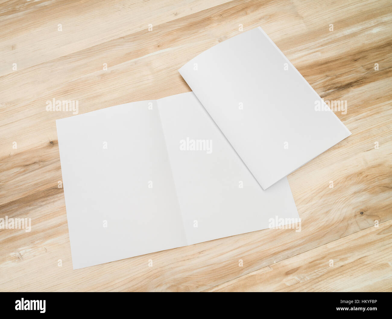 Bifold white template paper on wood texture Stock Photo - Alamy