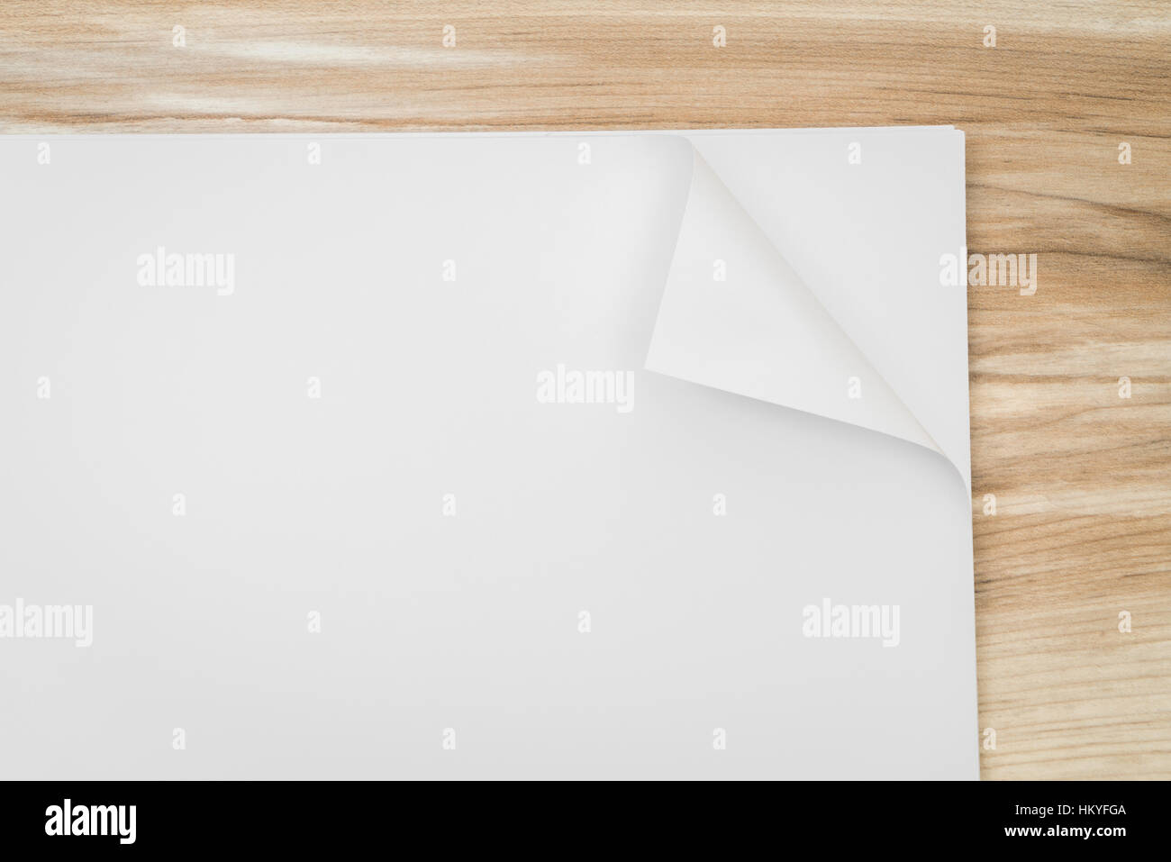 Real Paper Corner Fold on wood background Stock Photo - Alamy