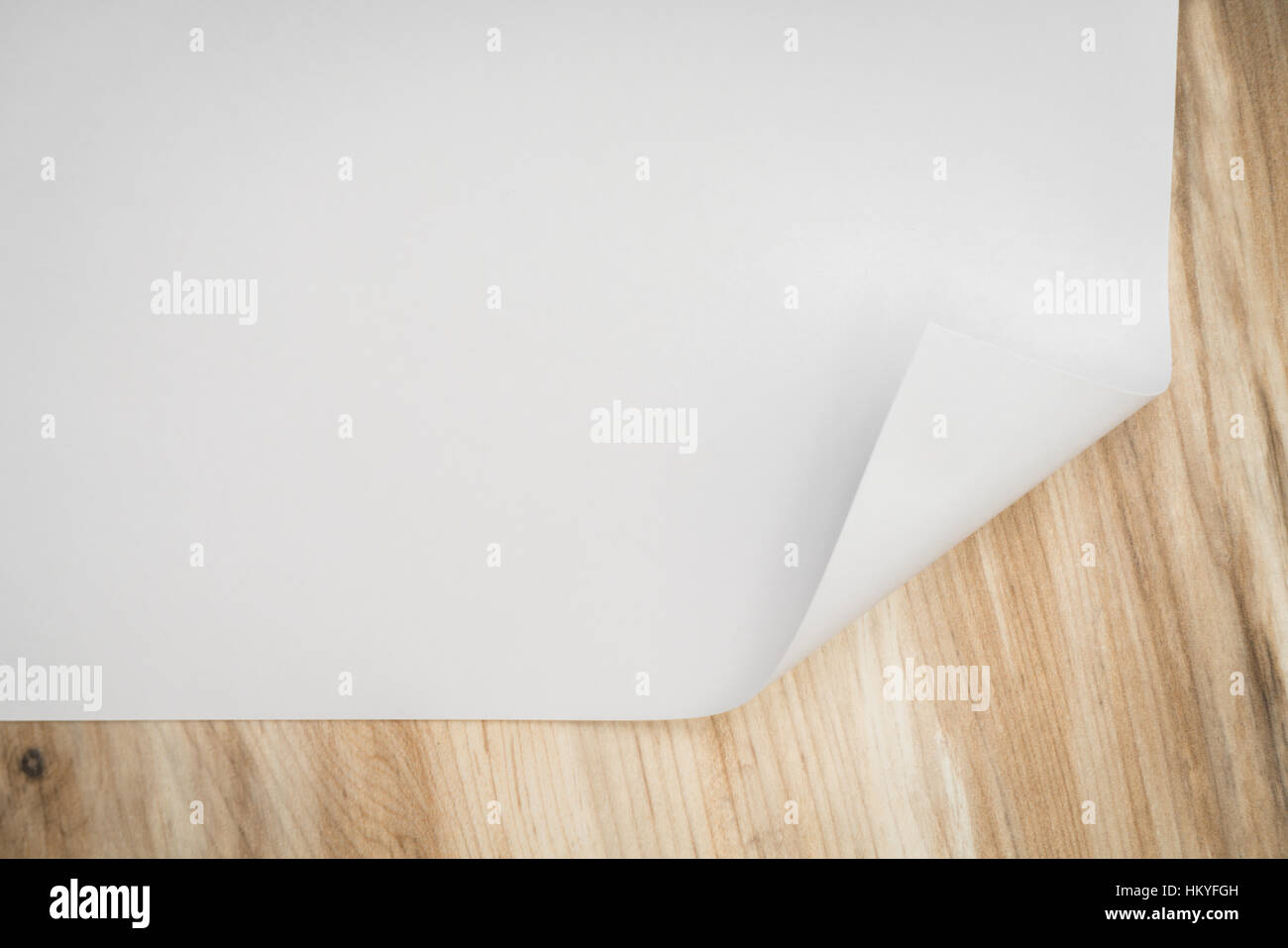 Real Paper Corner Fold on wood background Stock Photo - Alamy