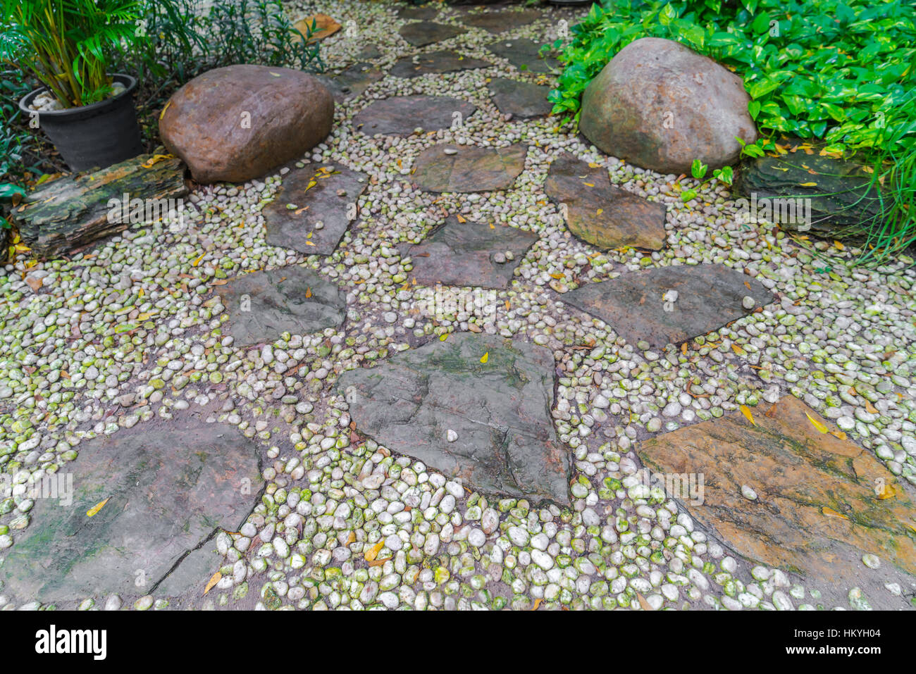Flagstone walkway in garden Stock Photo - Alamy