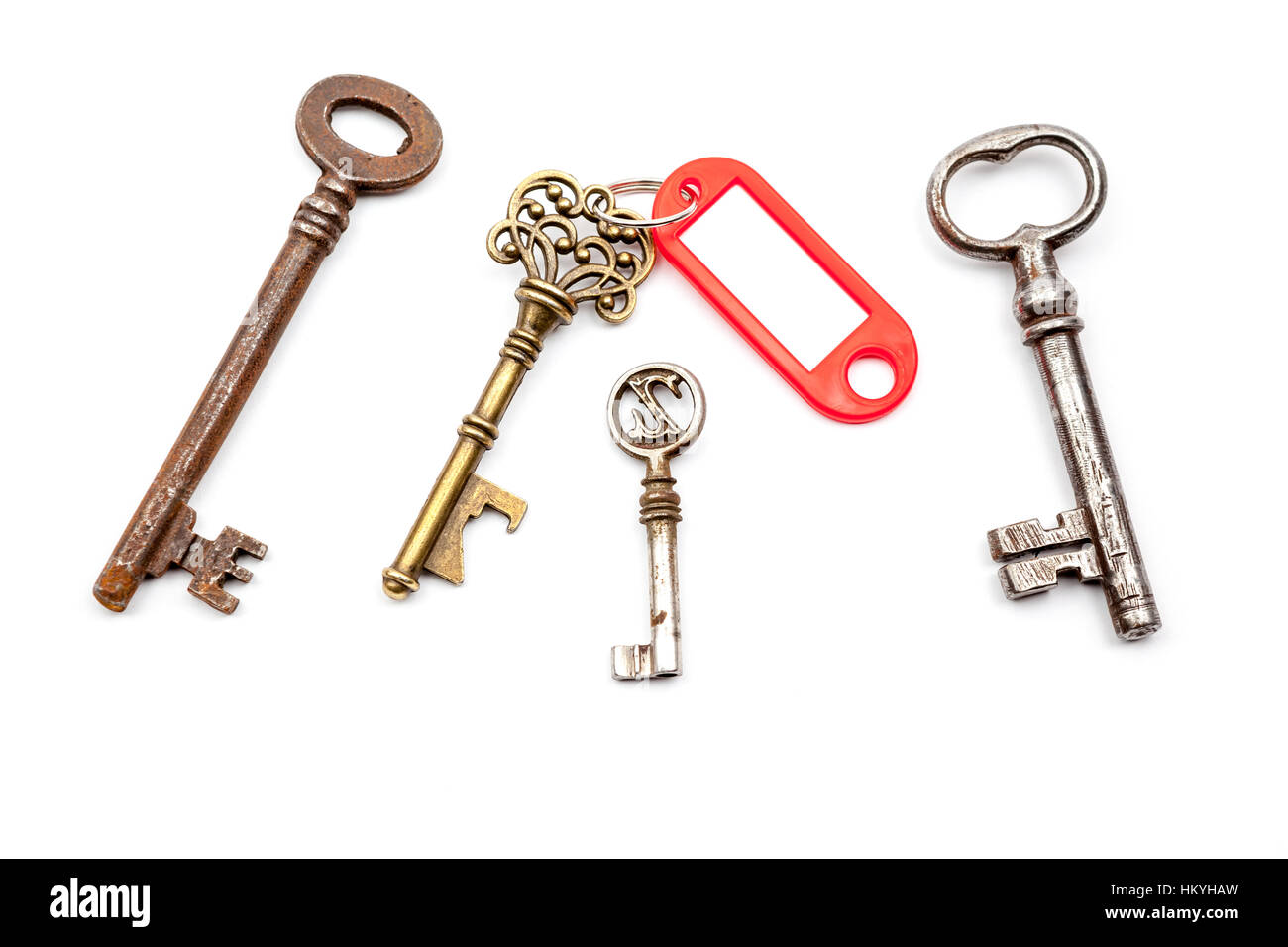 on white background an antique key with color label Stock Photo - Alamy