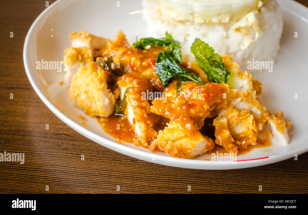 Rice with crispy chicken and fried egg Stock Photo - Alamy