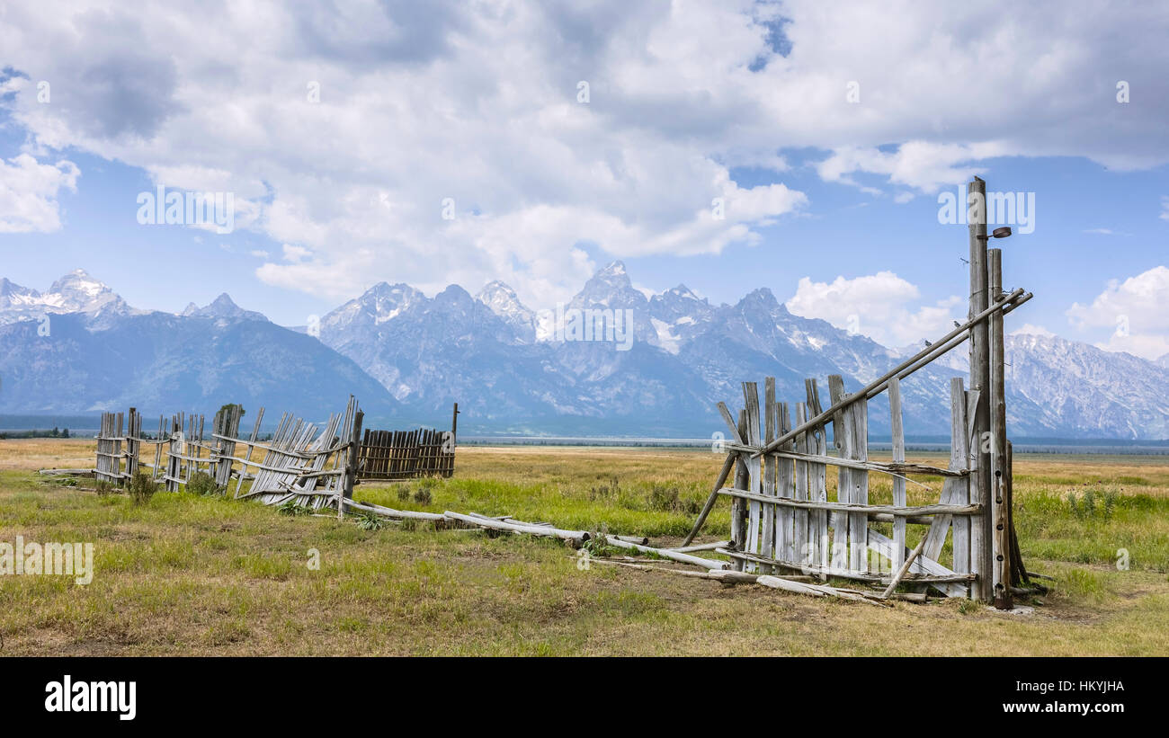 Early Mormon settlement and collapsed fence against the Grand Tetons ...