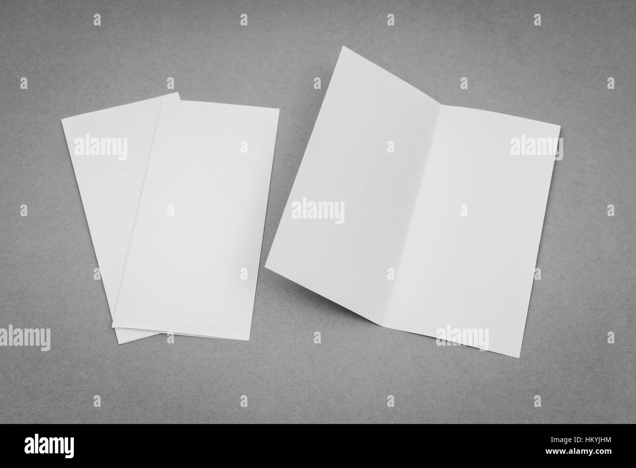 Bifold white template paper on gray background Stock Photo - Alamy